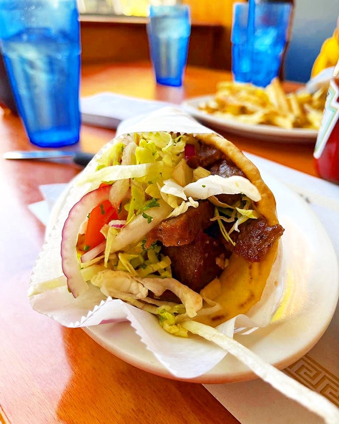 Meet the star of the show: a gyro so perfectly constructed it deserves its own architectural award. Those fresh veggies provide the crunch factor!