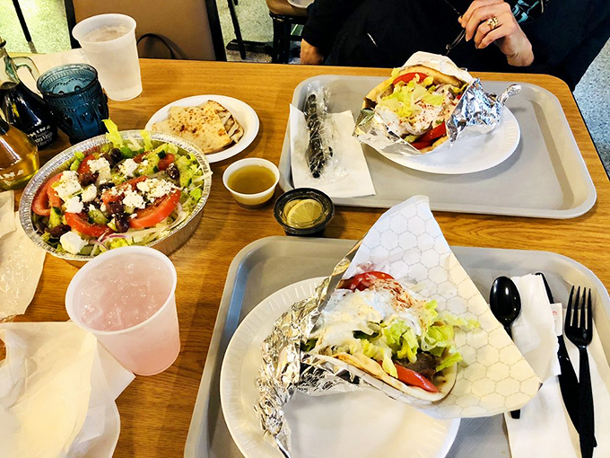 A feast fit for Zeus himself! Greek salad bursting with feta, gyros wrapped in foil like precious gifts, and enough tzatziki to swim in.