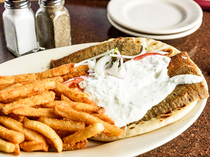 The gyro that launched a thousand cravings. Golden fries stand at attention beside a sandwich bursting with meat and tzatziki&mdash;a perfect harmony of textures.