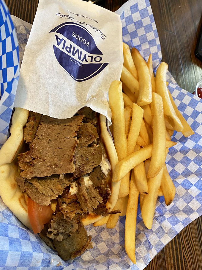 This isn't just lunch&mdash;it's a vacation on a blue-checkered wrapper. Perfectly sliced gyro meat snuggles into a warm pita with golden fries standing guard.