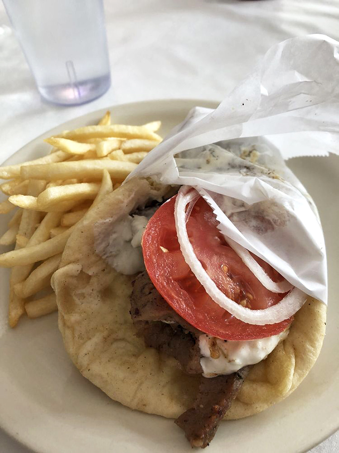 This isn't just a gyro, it's edible architecture&mdash;perfectly stacked meat, fresh veggies, and tzatziki sauce that dreams are made of.