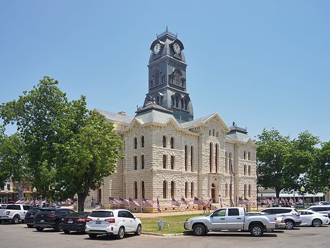 The majestic Hood County Courthouse stands like a limestone guardian of Granbury, its clock tower keeping time for both past and present.