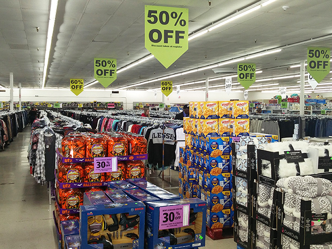 The clothing section: where fashion meets frugality under those lime-green 50% OFF banners that whisper sweet nothings to your budget.