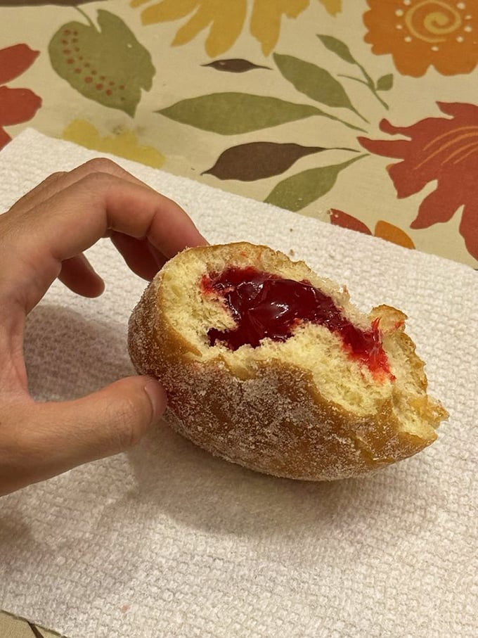 This jelly donut doesn't just leak filling&mdash;it erupts with ruby-red raspberry that makes your inner child do backflips. 