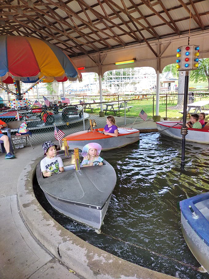 Little captains navigate their vessels with serious determination. These kiddie boats might not sail the seven seas, but they're launching lifelong amusement park love affairs.