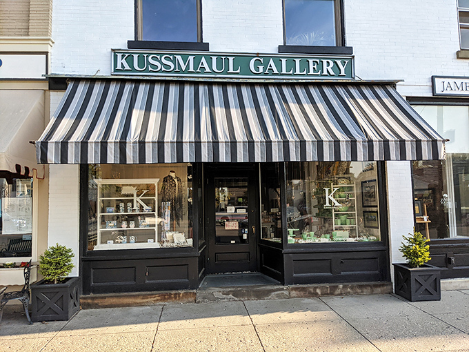 Behind that classic striped awning, Kussmaul Gallery showcases art that makes you pause. The kind of place where window shopping becomes an afternoon affair.