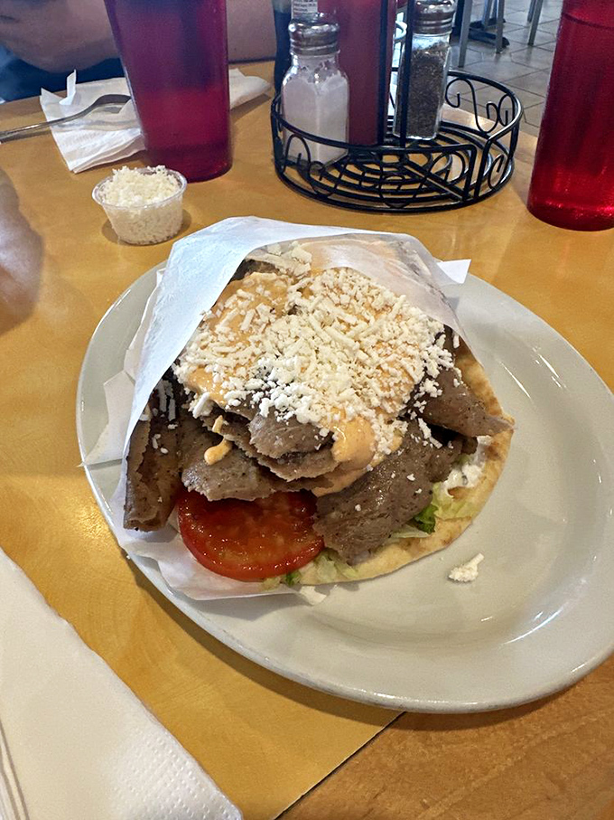 This isn't just a gyro&mdash;it's edible architecture. Layers of seasoned lamb, fresh veggies, and feta create a handheld masterpiece worth crossing town for.