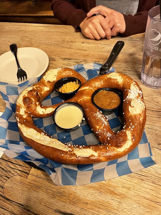 This pretzel isn't just big&mdash;it's the Schwarzenegger of baked goods, flexing its golden-brown muscles alongside three perfect dipping companions.