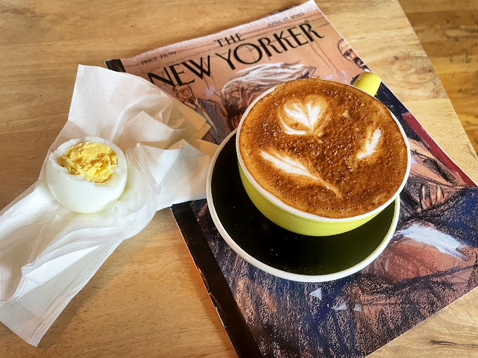 This latte isn't just Instagram-worthy&mdash;it's a legitimate reason to skip breakfast meetings. The hard-boiled egg sidekick is just showing off at this point.