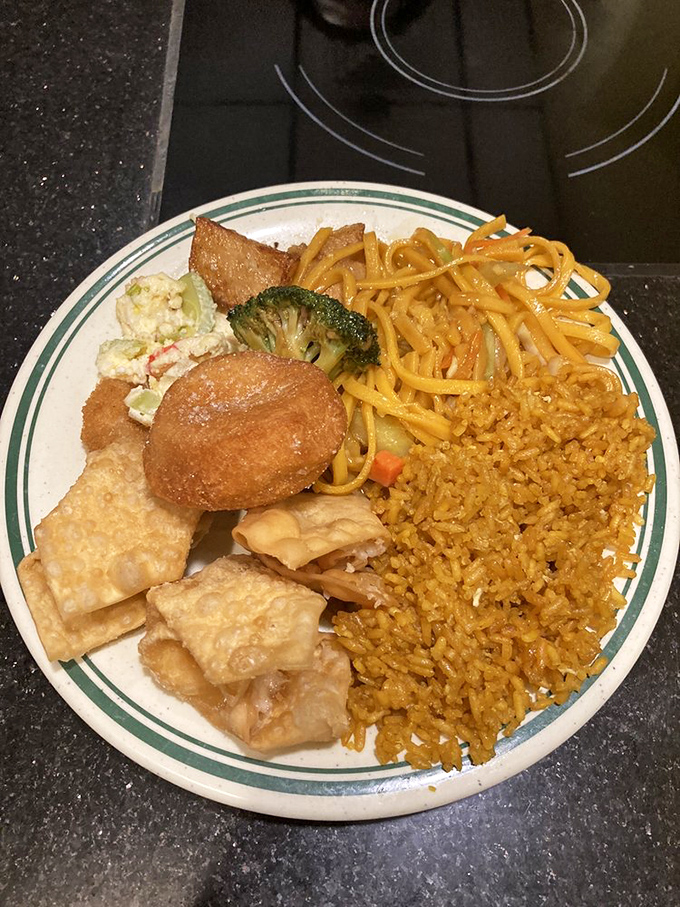 A plate assembled with the precision of a NASA engineer &ndash; the golden fried rice, tender lo mein, and that crab rangoon calling your name.