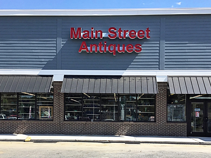 Main Street Antiques announces itself boldly against the sky &ndash; a siren call to collectors and the simply curious alike.