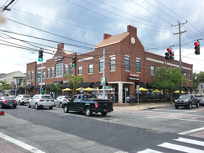 Corner buildings house local eateries where students and retirees alike gather. This intersection represents Newark's perfect blend of college-town energy and established community.