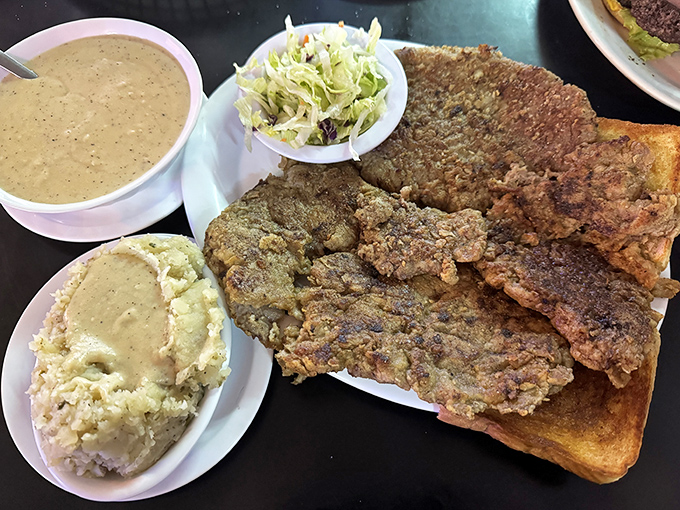 Not so much a chicken fried steak as a chicken fried continent, threatening to capsize the plate beneath its golden-crusted magnificence.