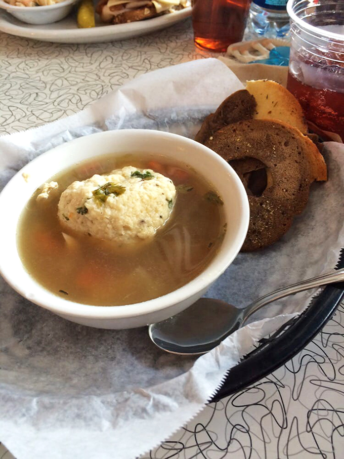 Behold, the matzo ball soup that launched a thousand road trips. That golden broth has more depth than most Hollywood scripts.