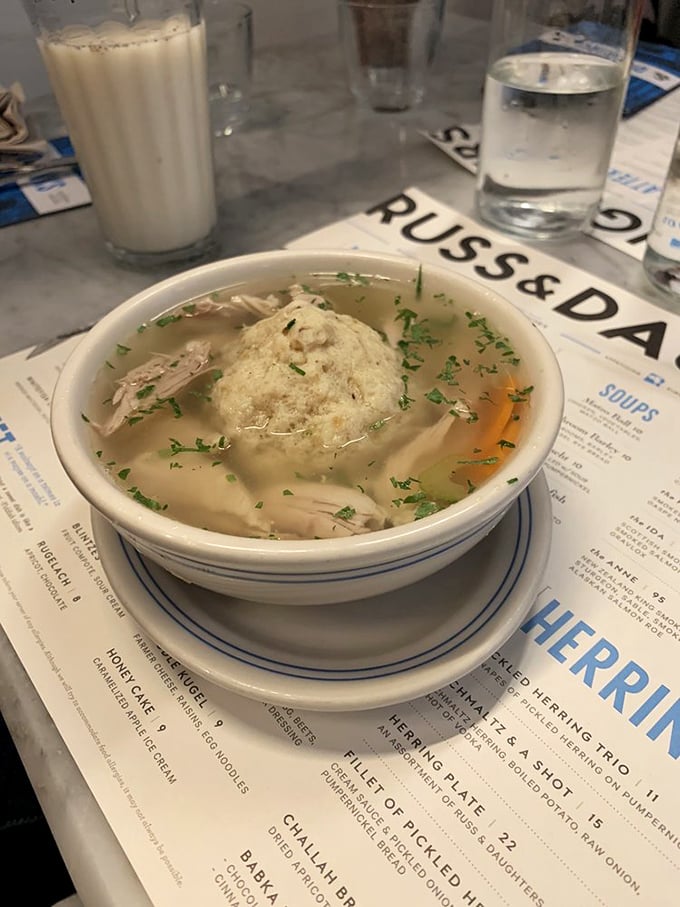 The matzo ball soup &ndash; clear golden broth with that perfectly poised dumpling &ndash; is chicken soup for the New Yorker's soul.
