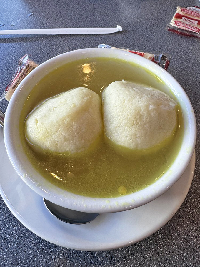 Behold, the crown jewel: matzo ball soup with dumplings so fluffy they practically float above the golden broth.