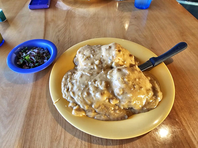 Biscuits swimming in creamy gravy &ndash; comfort food that hugs your soul while simultaneously plotting against your diet plans.