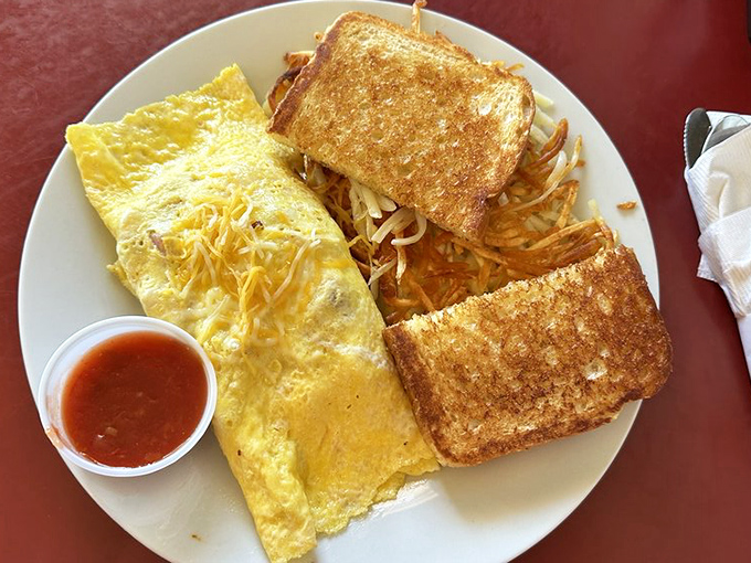 Breakfast perfection doesn't need fancy names&mdash;just a fluffy omelet, perfectly toasted bread, and hash browns that strike the ideal balance between crispy and tender.