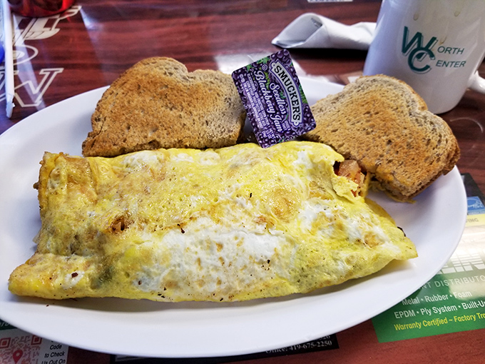 This omelet doesn't just hang off the plate&mdash;it establishes dominance over it, with a side of toast standing by like loyal subjects.