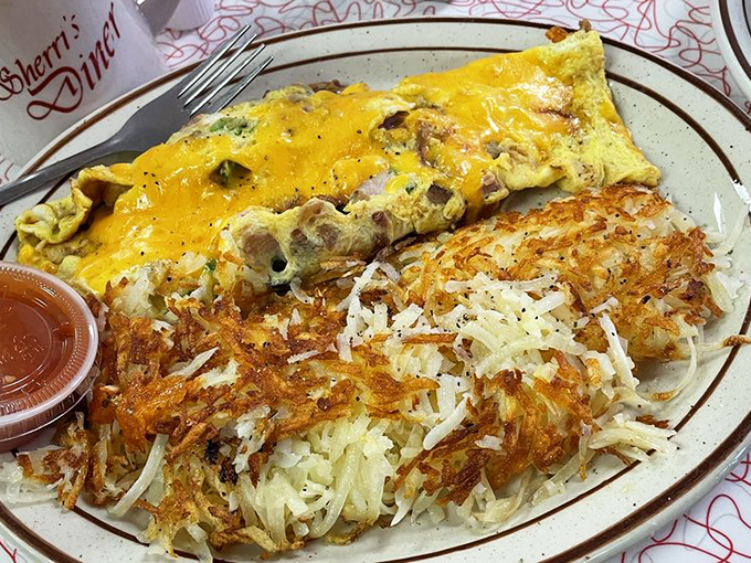 Golden hash browns sharing the spotlight with fluffy scrambled eggs&mdash;a breakfast duet that performs in perfect harmony on this well-seasoned stage. 