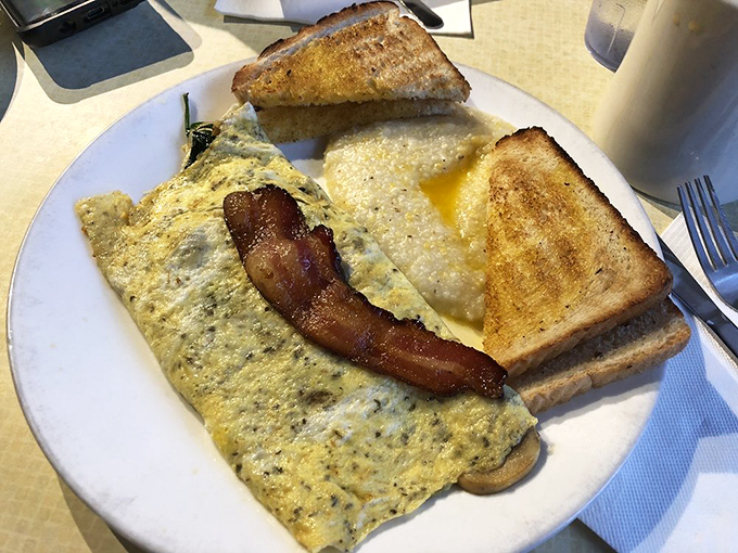 This isn't just an omelet&mdash;it's an edible monument to morning indulgence. Paired with perfectly golden toast and crispy bacon, it's the breakfast trifecta of champions.