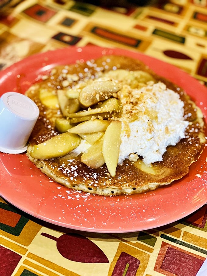This pancake with caramel apples and whipped cream isn't breakfast&mdash;it's dessert with an alibi and diplomatic immunity.