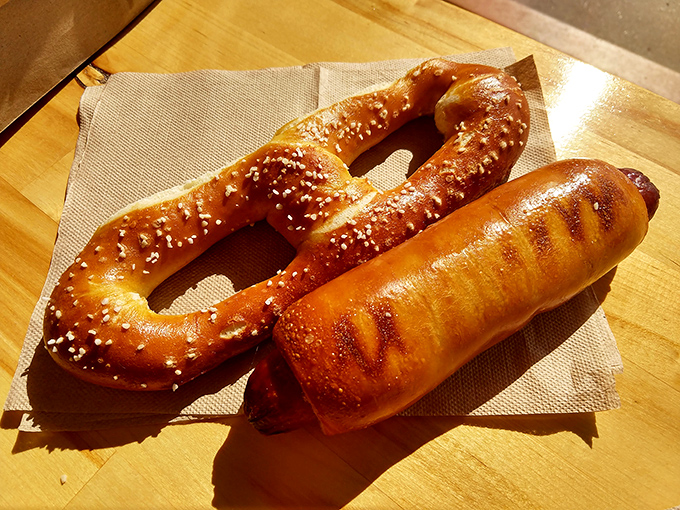 The dynamic duo of comfort food: a classic salted pretzel and pretzel-wrapped hot dog. Simplicity perfected on parchment paper.