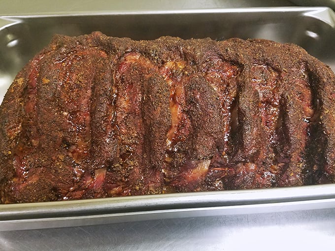 These ribs aren't just cooked&mdash;they're transformed through smoke and time into something primal and perfect, wearing their spice rub like a badge of honor.