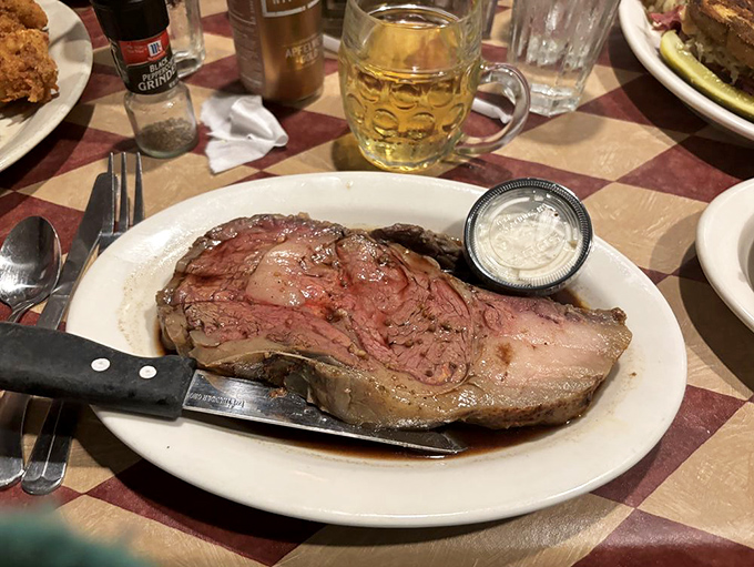 That glistening prime rib alongside a proper German beer is the kind of pairing that makes you question why you'd ever order anything else.