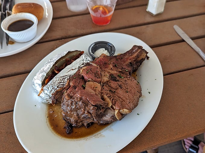 Behold the star of the show&mdash;prime rib so perfectly cooked it makes grown adults weep with joy. That bone suggests this isn't just dinner, it's an event.