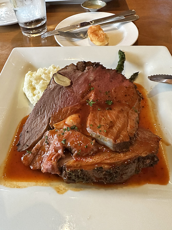 The star of the show: Pine Tavern's legendary prime rib, perfectly medium-rare with a ribbon of fat that melts like butter on your eager tongue.