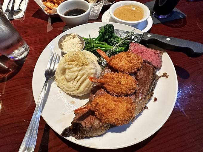 The surf and turf dream team: prime rib cooked to rosy perfection alongside golden-fried prawns. Resistance is futile.