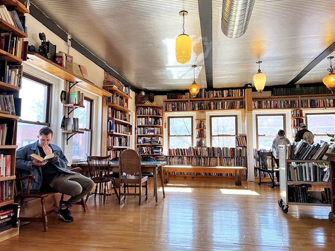 A quiet corner where time slows down and pages turn. The sunlight streaming through windows transforms ordinary reading into sacred ritual.