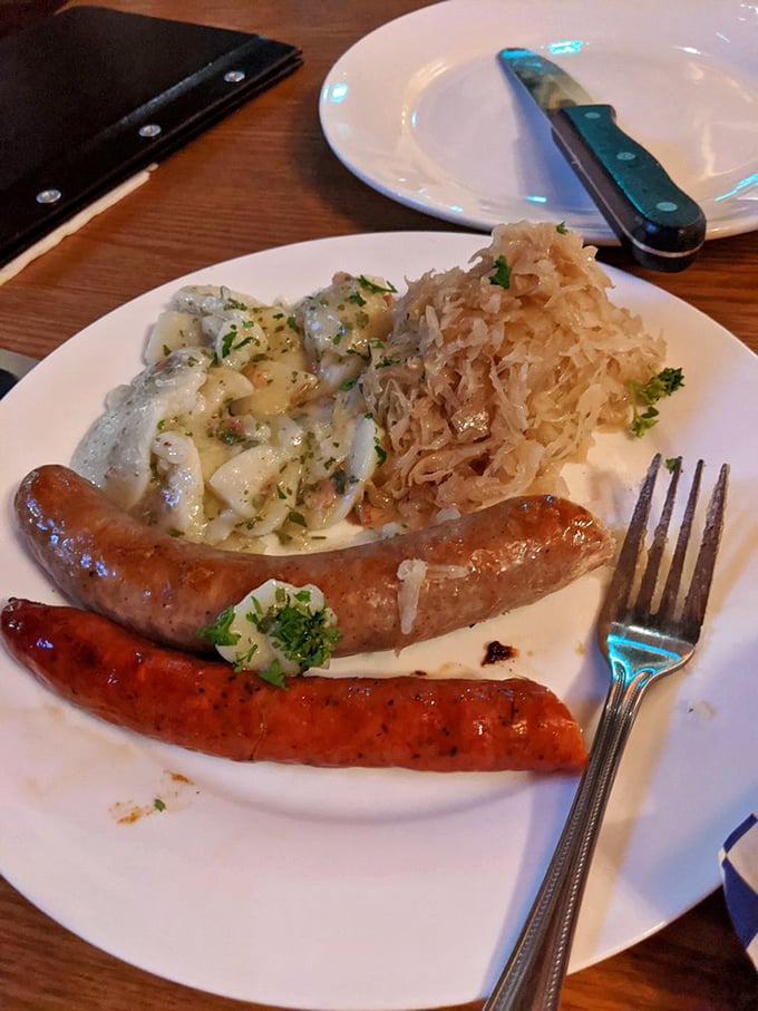 Two perfect sausages&mdash;crisp-skinned and succulent&mdash;nestled beside that legendary potato salad. This plate is Munich's greatest hit album.