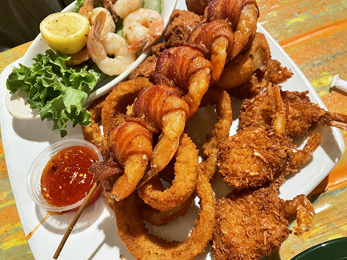 Golden-fried perfection that makes you want to high-five the chef. This shrimp trio with onion rings is what seafood dreams are made of.