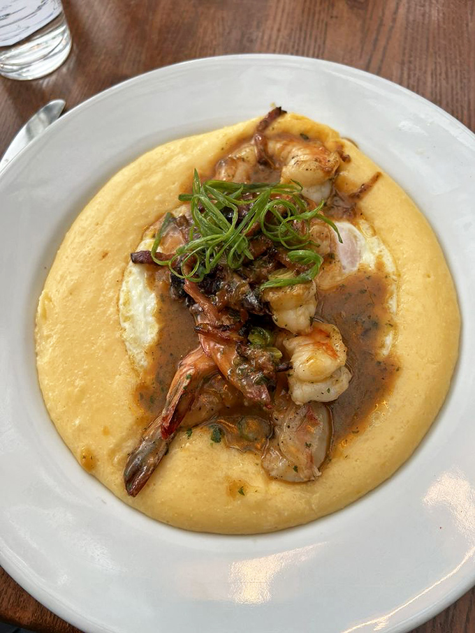 Behold the holy grail: creamy yellow grits forming a heavenly bed for plump shrimp swimming in tomato-garlic butter sauce.