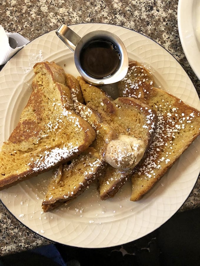 The French toast that launched a thousand return visits. That dusting of powdered sugar isn't decoration&mdash;it's a snow-capped mountain of breakfast bliss.