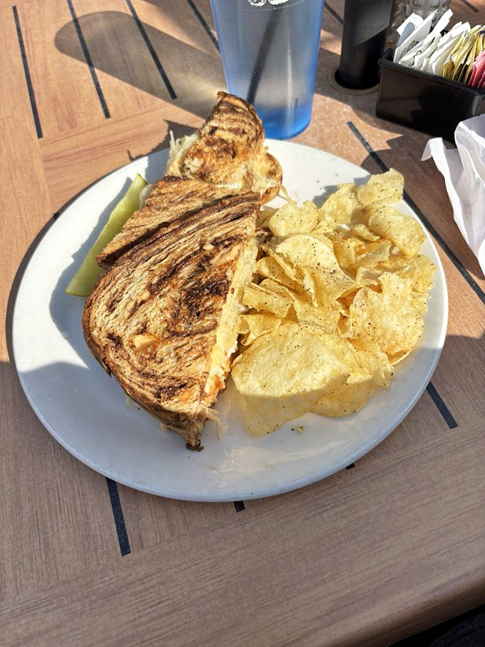 Grilled to perfection and stacked high, this sandwich isn't just lunch&mdash;it's architecture with a side of potato chips.