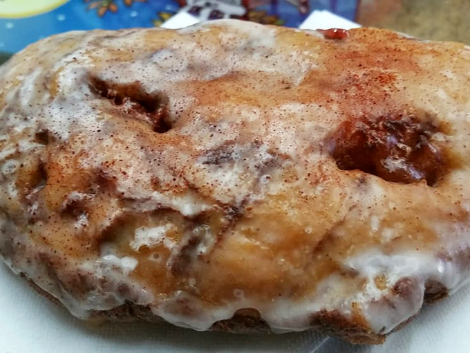 This apple fritter isn't just a pastry, it's a topographical marvel&mdash;peaks of cinnamon-dusted dough and valleys of apple goodness under a perfect glaze.
