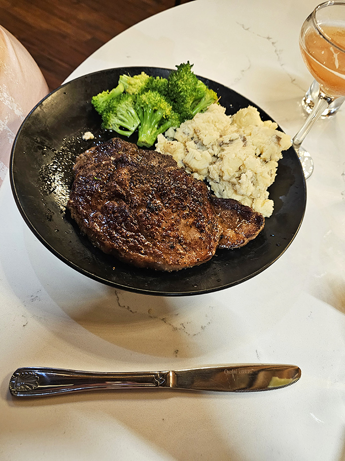A perfectly seared steak alongside vibrant broccoli and creamy mashed potatoes. This isn't just dinner&mdash;it's a balanced argument against ever cooking at home again.