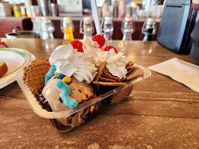 Dessert architecture at its finest! This sundae balances creamy scoops with crunchy waffle chips in a harmony that would make any sweet tooth sing.