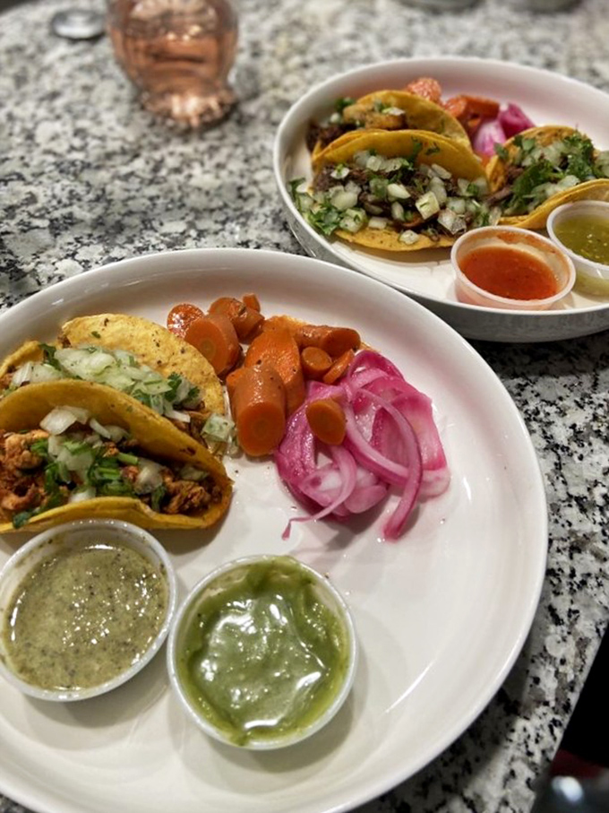 Each taco arrives like a tiny masterpiece – simple, unpretentious, and carrying flavors that make you wonder why you ever settled for less.