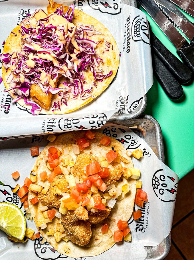 These aren't just tacos—they're edible masterpieces with vibrant purple cabbage and diced vegetables that make your standard taco joint look like it needs a color upgrade.