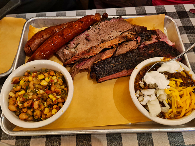 The Texas Trinity plate &ndash; where brisket, ribs, and sausage come together in smoky harmony that'll make you want to tip your non-existent cowboy hat.