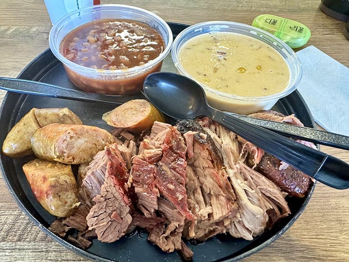 This three-meat plate isn't just dinner&mdash;it's a guided tour through the promised land of perfectly smoked proteins, with sides playing worthy supporting roles.