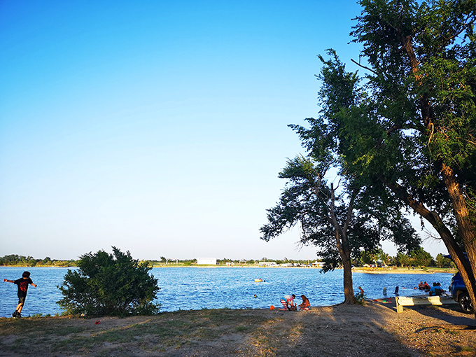 Families gather under endless skies, creating the kind of summer memories that survive long after sunburns fade and school bells ring.