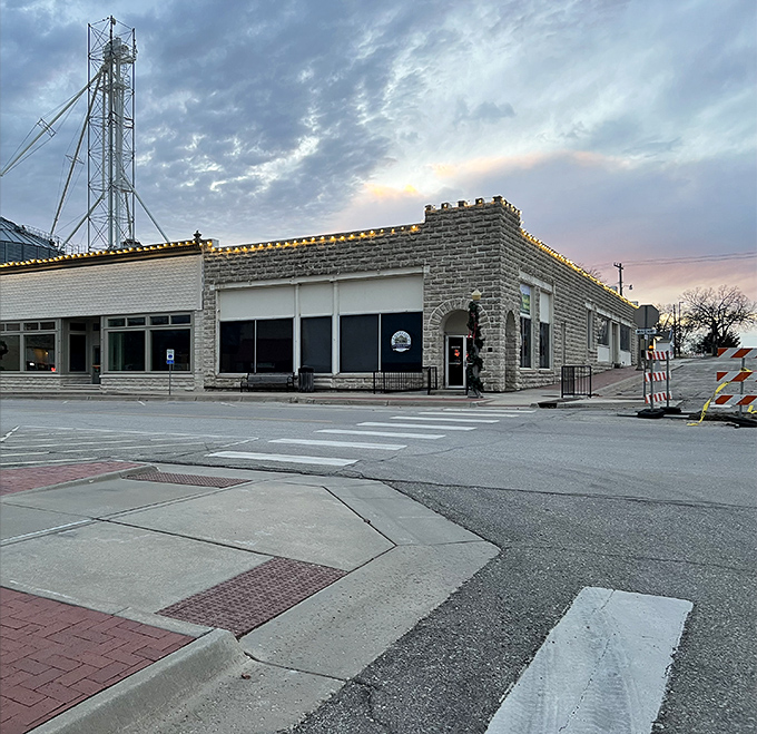 Twilight settles over downtown Alma, where limestone buildings stand sentinel against time. Even the streetlights seem to move at a more civilized pace.