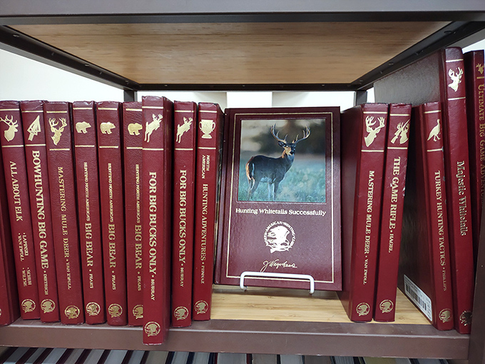 For outdoorsmen and nature enthusiasts, a dedicated collection of hunting guides sits ready to share wilderness wisdom between burgundy spines.
