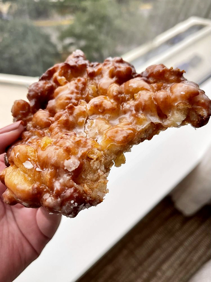 Behold the holy grail of apple fritters - a craggy, caramelized masterpiece that makes getting up at 4 AM seem completely rational. 
