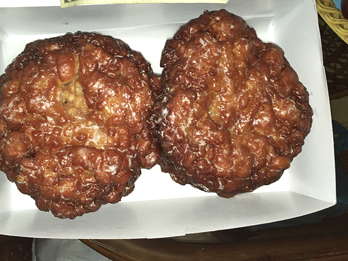 These apple fritters aren't just breakfast—they're an event. With a surface like delicious edible terrain and glaze that catches light like morning dew.